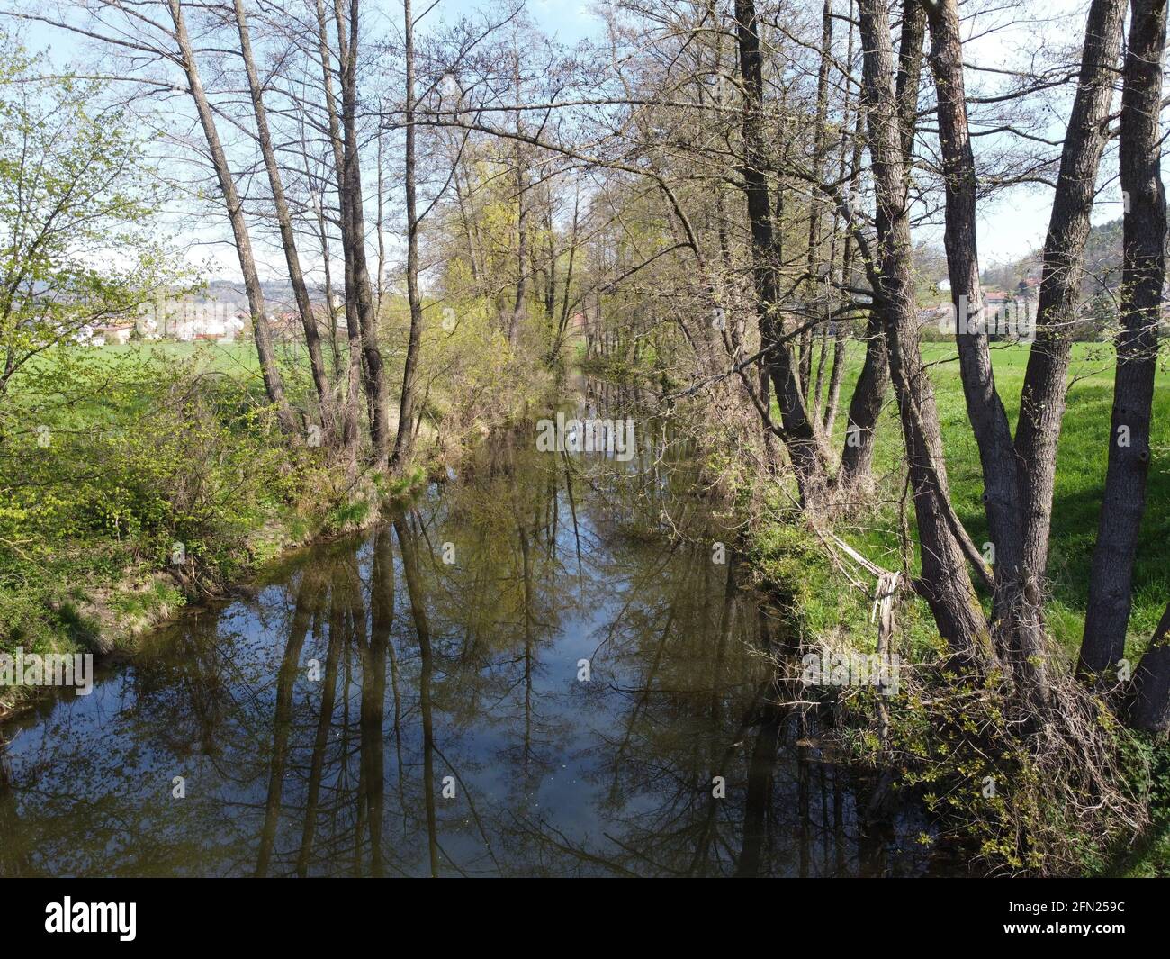 Green landscape with a river and trees Stock Photo - Alamy