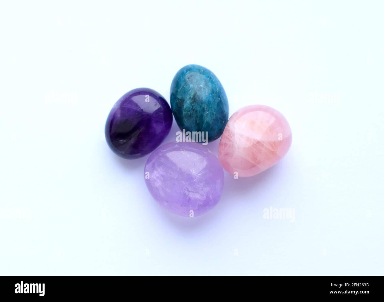 Multi-colored gemstones, cut tumbling stones. Amethyst, rose quartz ...