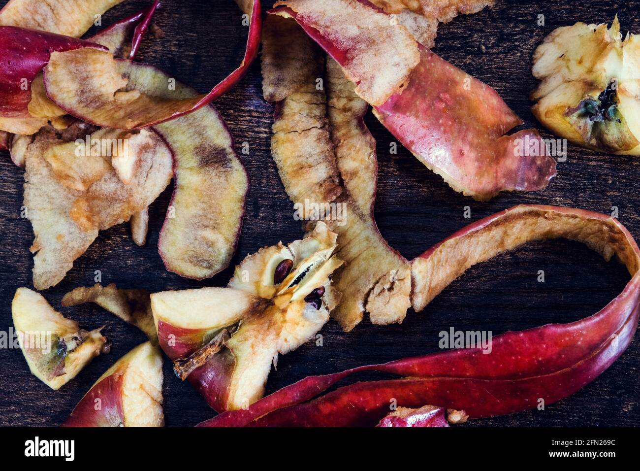 close-up of the old peel of a red apple on wooden table Stock Photo - Alamy
