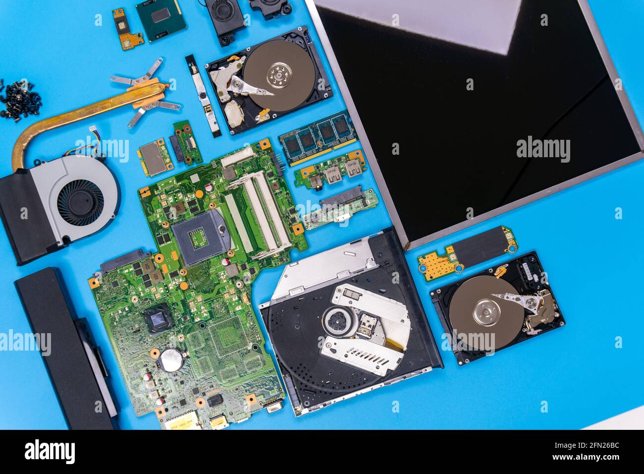 Parts of a modern computer. The insides of a laptop on a blue ...