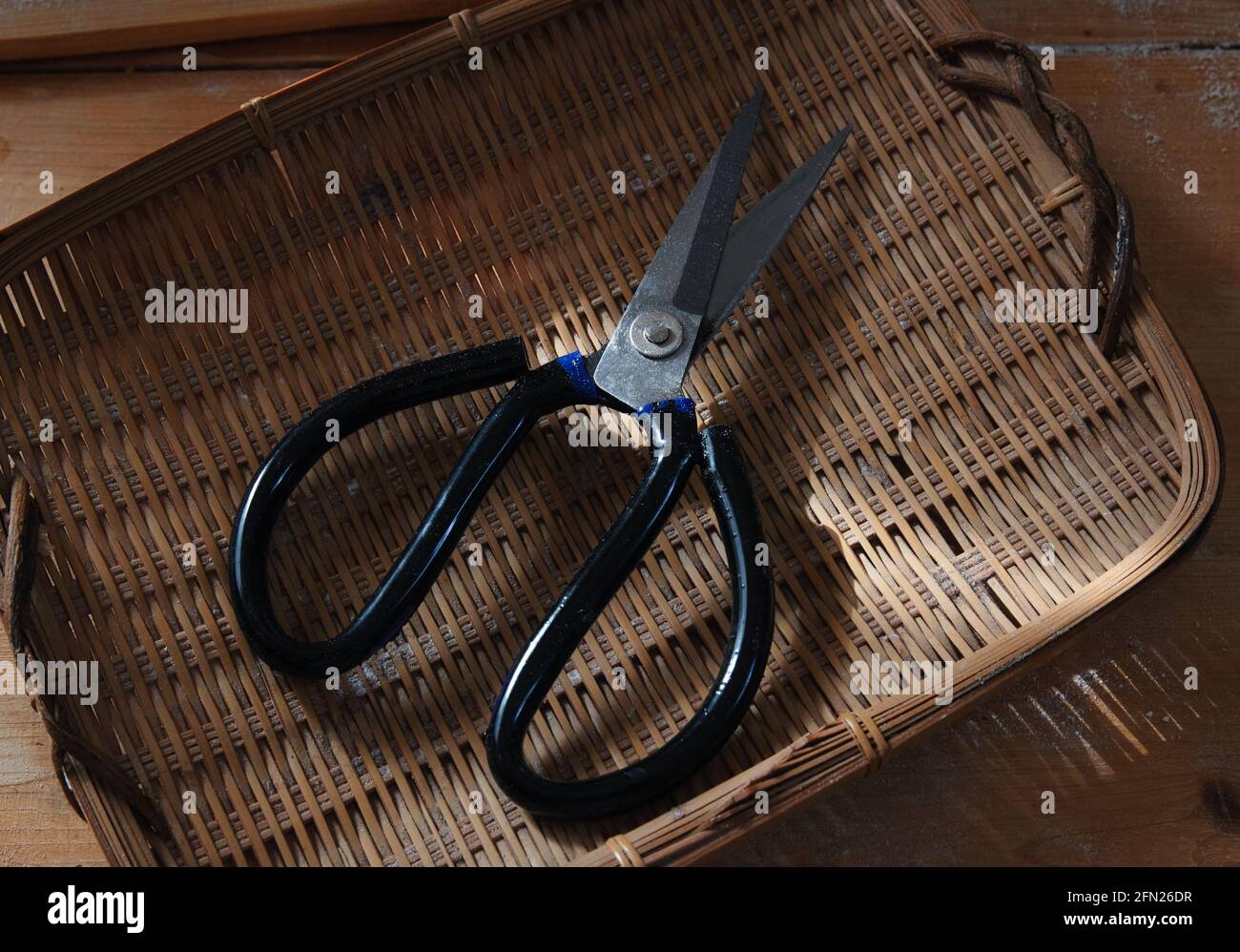 The scissors in the bamboo basket Stock Photo - Alamy