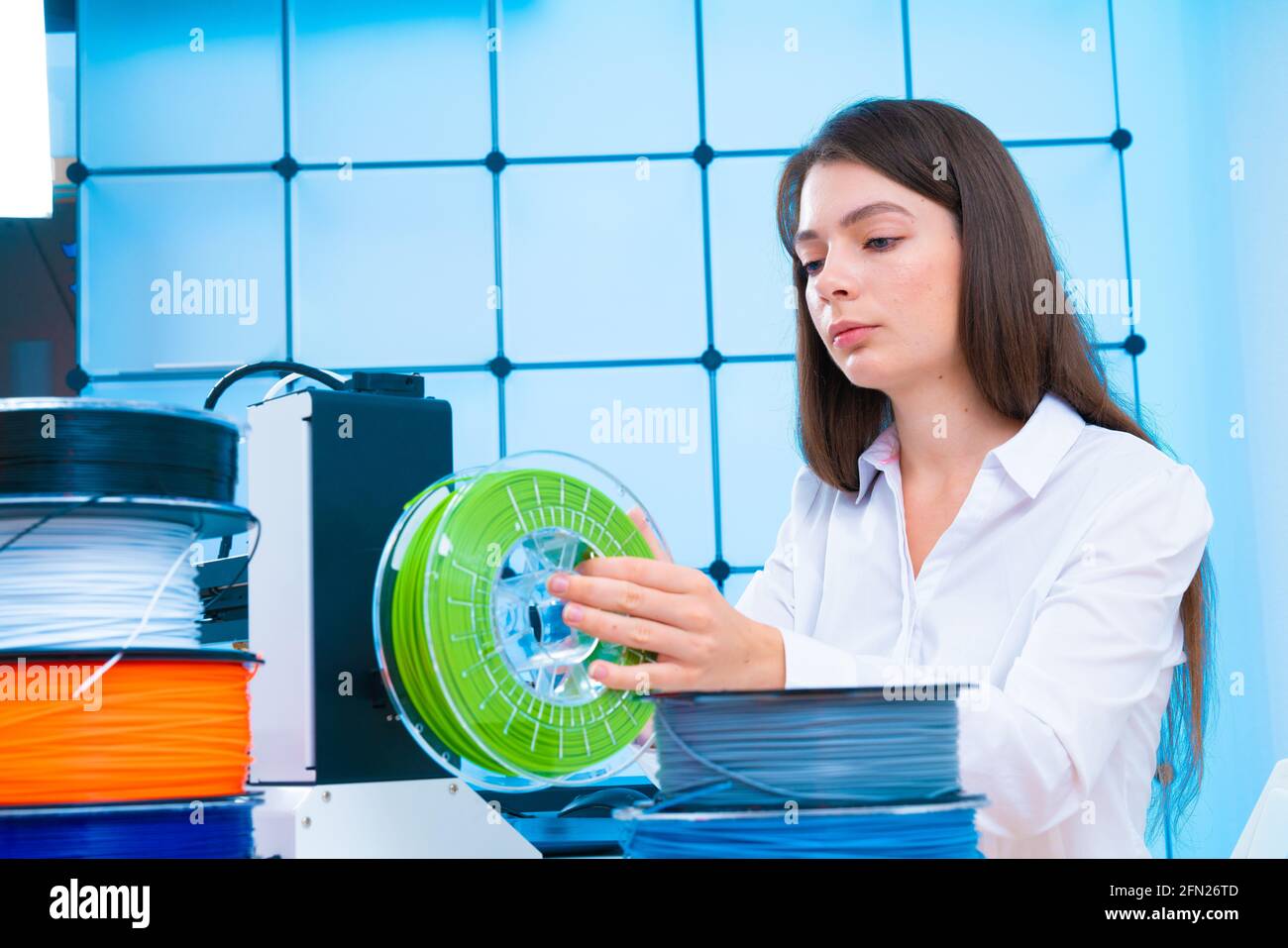 Young woman use 3d printer at office High quality photo Stock Photo - Alamy