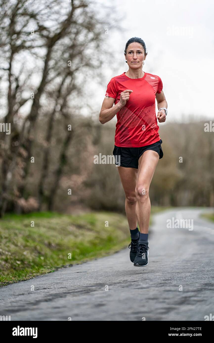Girl running in nature, it is her healthy and free lifestyle Stock ...