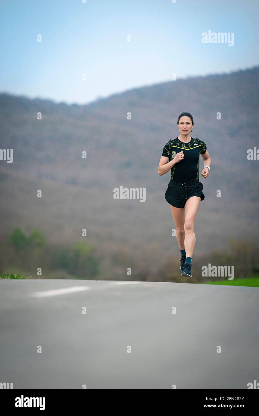 Girl running in nature, it is her healthy and free lifestyle Stock ...
