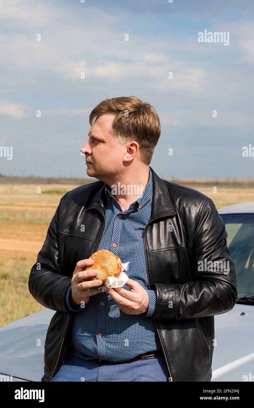 Male driver having lunch standing hi-res stock photography and images ...