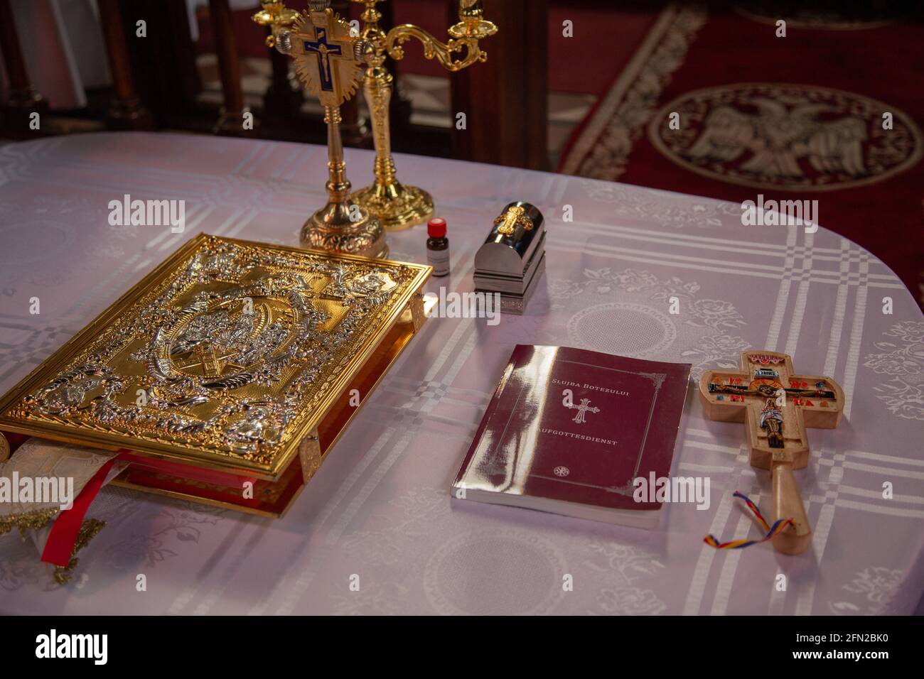 Table with bibles and crosses in a church Stock Photo - Alamy