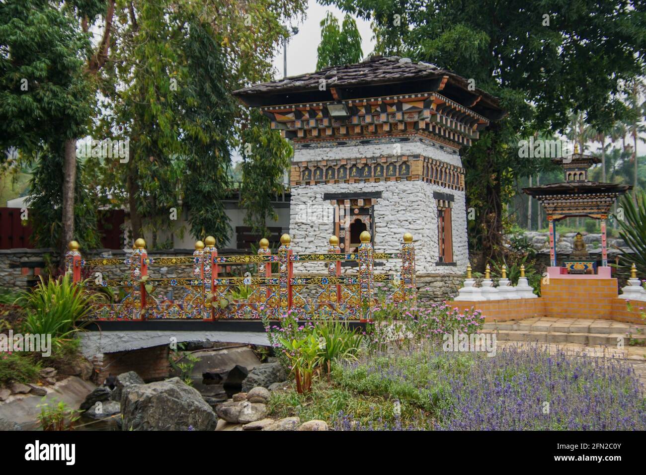 Closeup shot of a bridge and a small building in Asian style in summer ...
