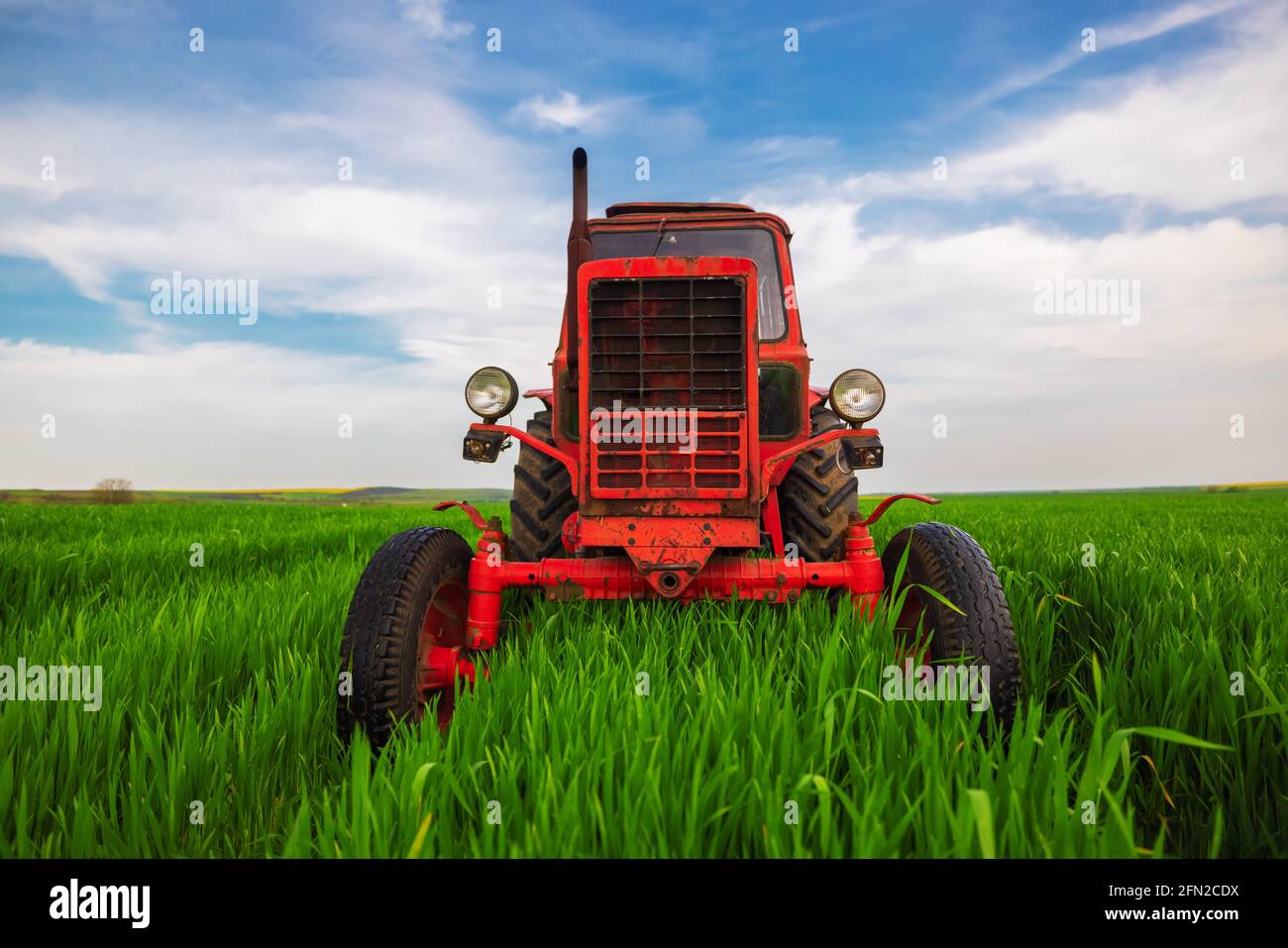 Tractor mowing green field, aerial view Stock Photo - Alamy