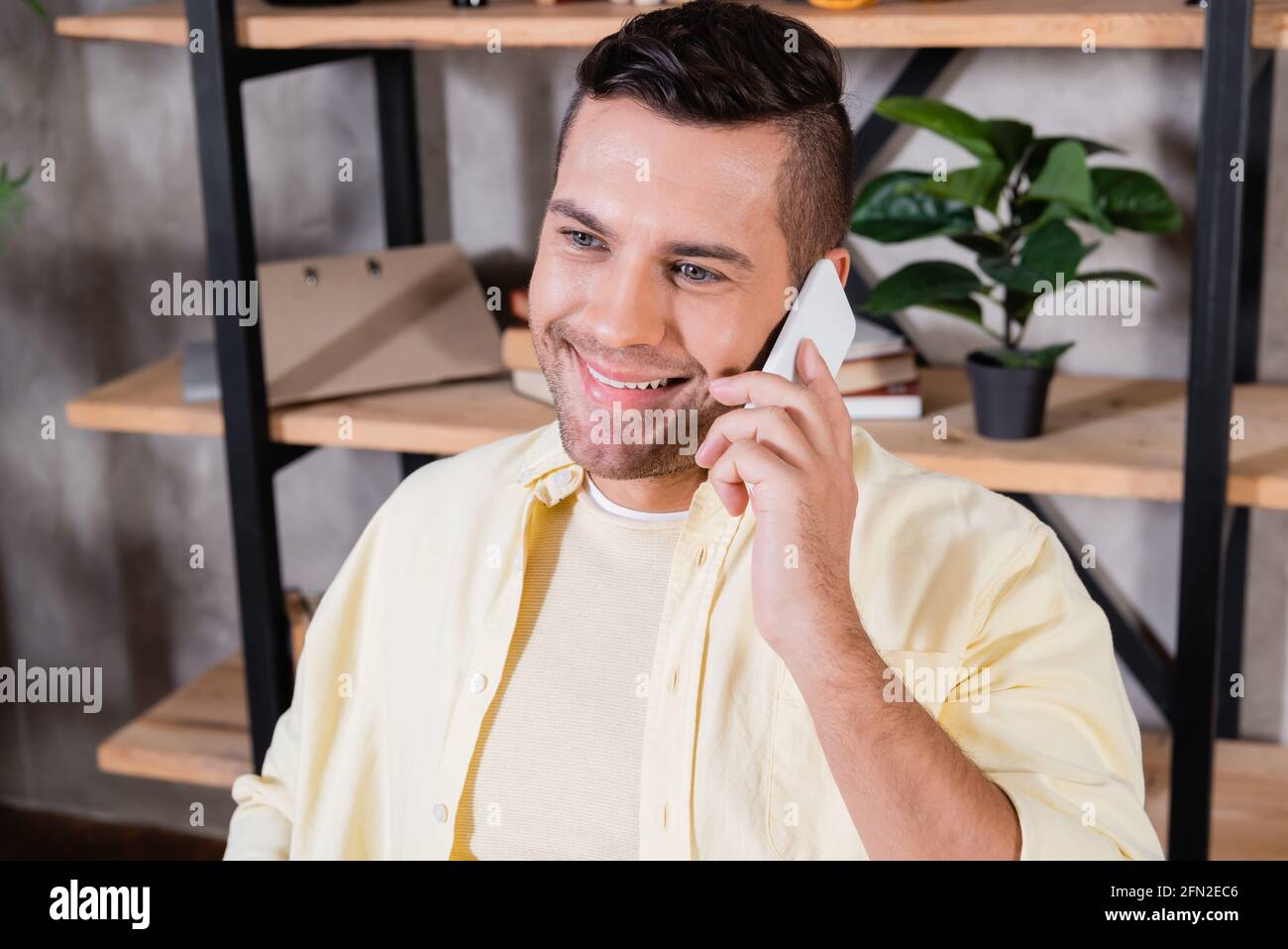 Handsome joyful man talking hi-res stock photography and images - Alamy