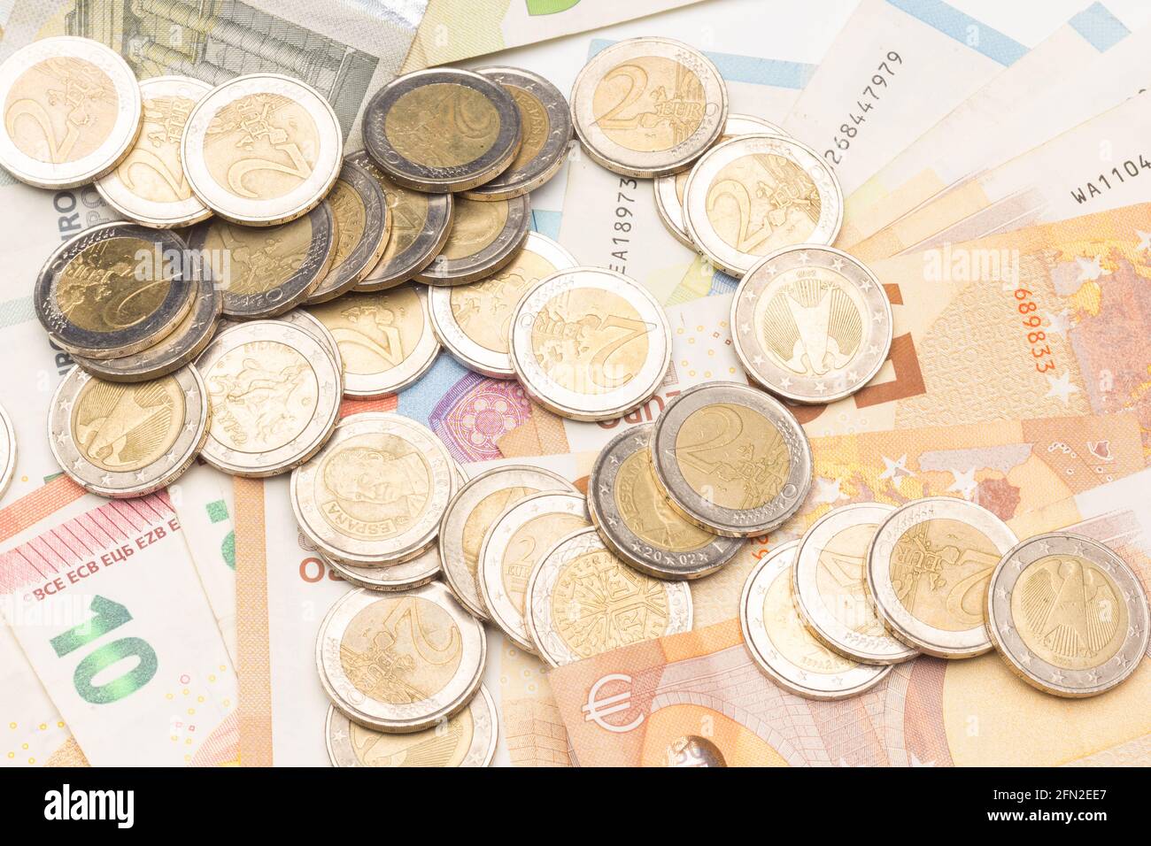 Euro coins and banknotes, close-up of the official currency of Europe ...