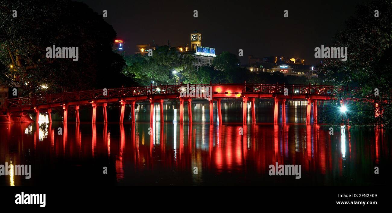 Red wooden bridge Huc in Hanoi at night Stock Photo - Alamy