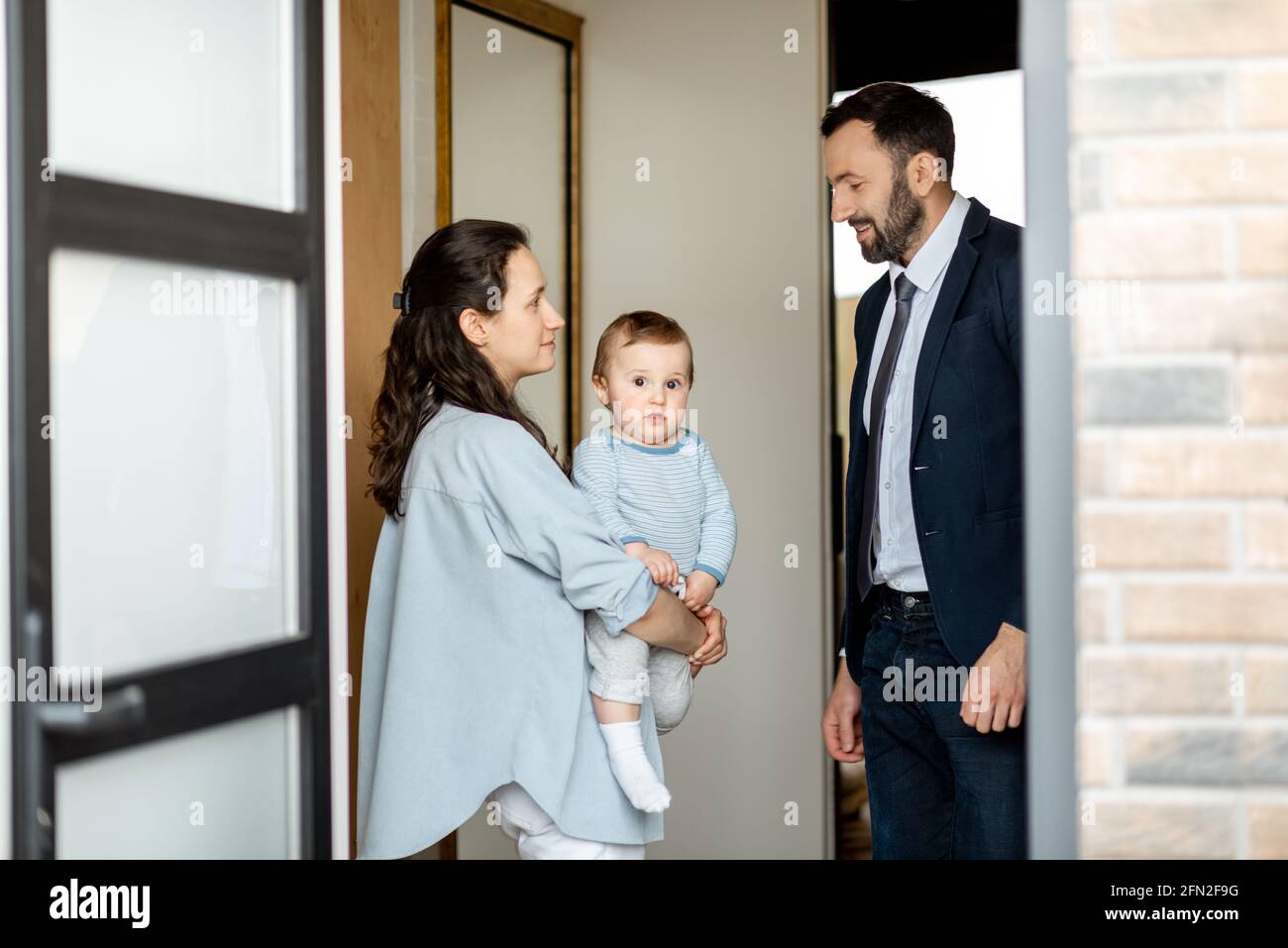 Father saying goodbye to family hi-res stock photography and images - Alamy