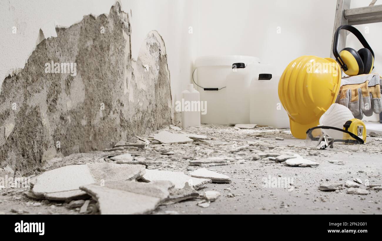 house renovation concept, wall in demolition with plaster rubble and ...