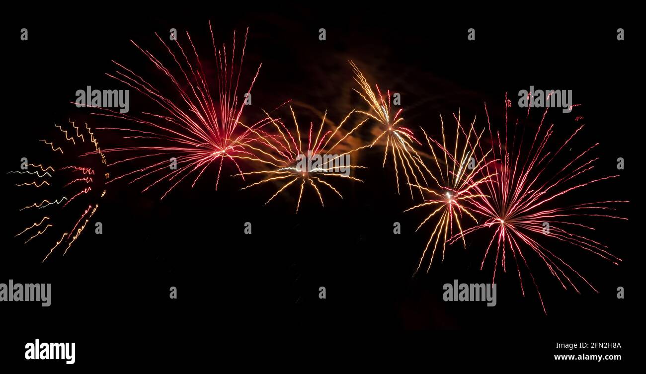 Bright festive fireworks against the night sky. Firework Fiery flowers ...