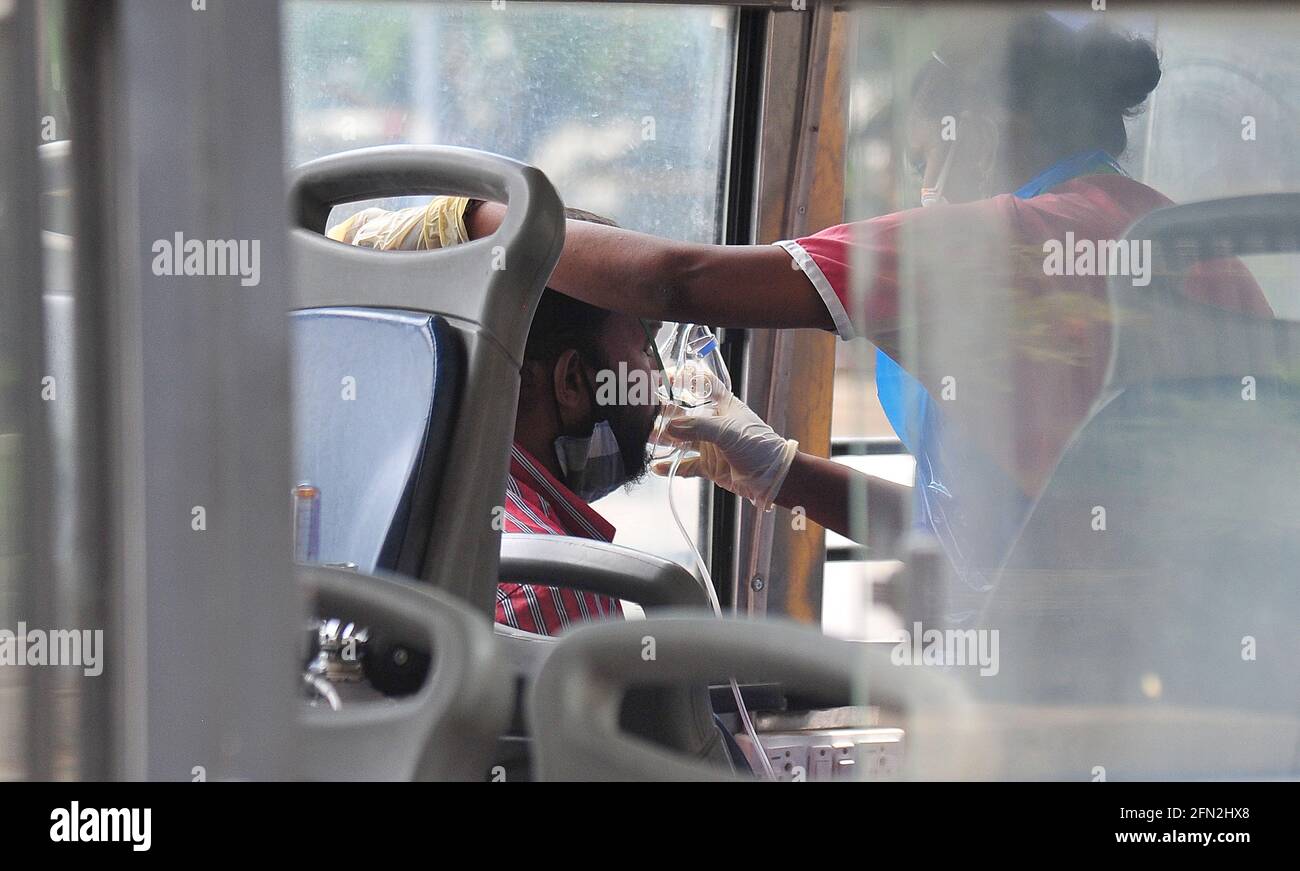 Bangalore, India. 13th May, 2021. A COVID-19 patient gets oxygen ...