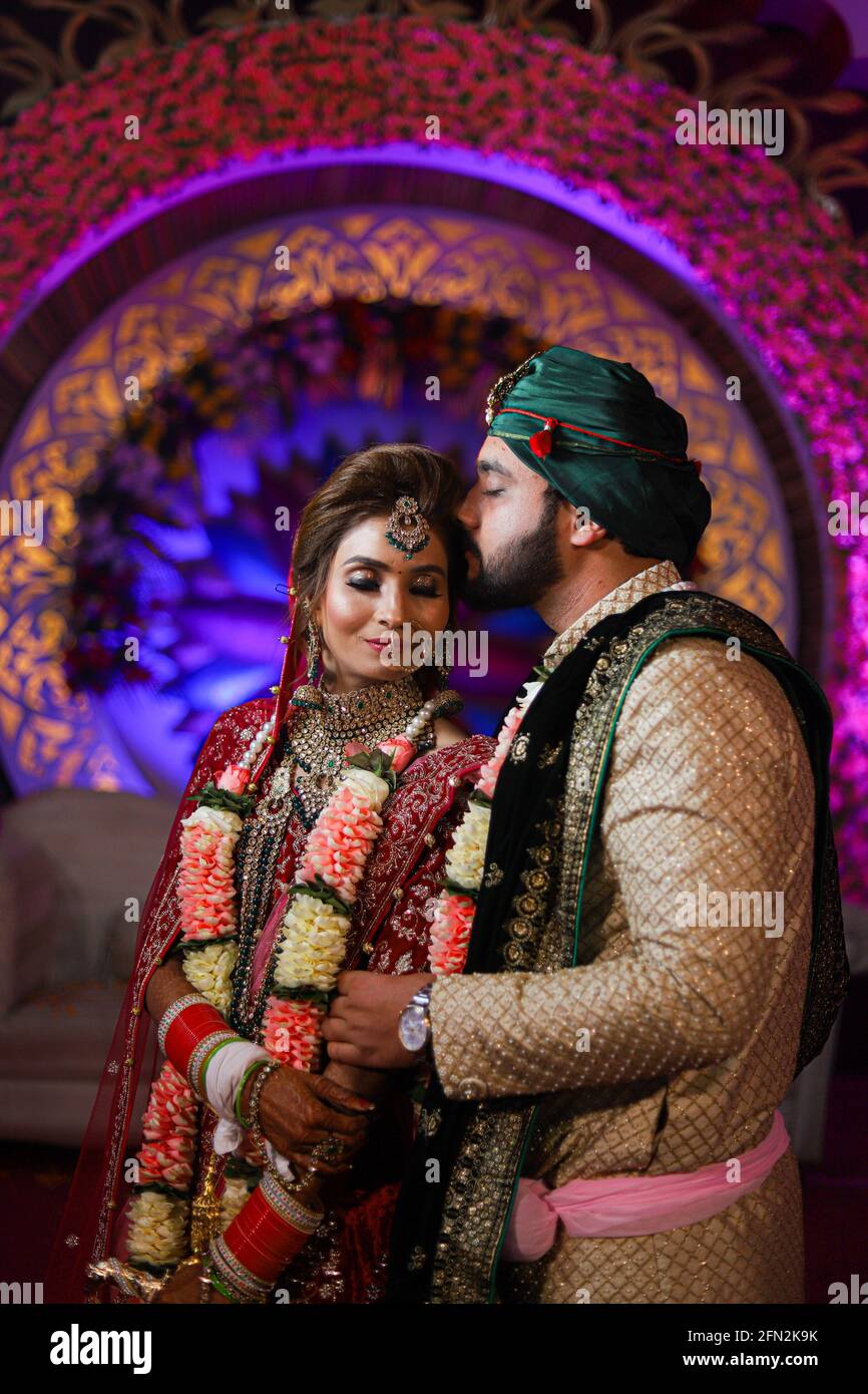 gorgeous stunning indian bride and groom wearing traditionally dress ...