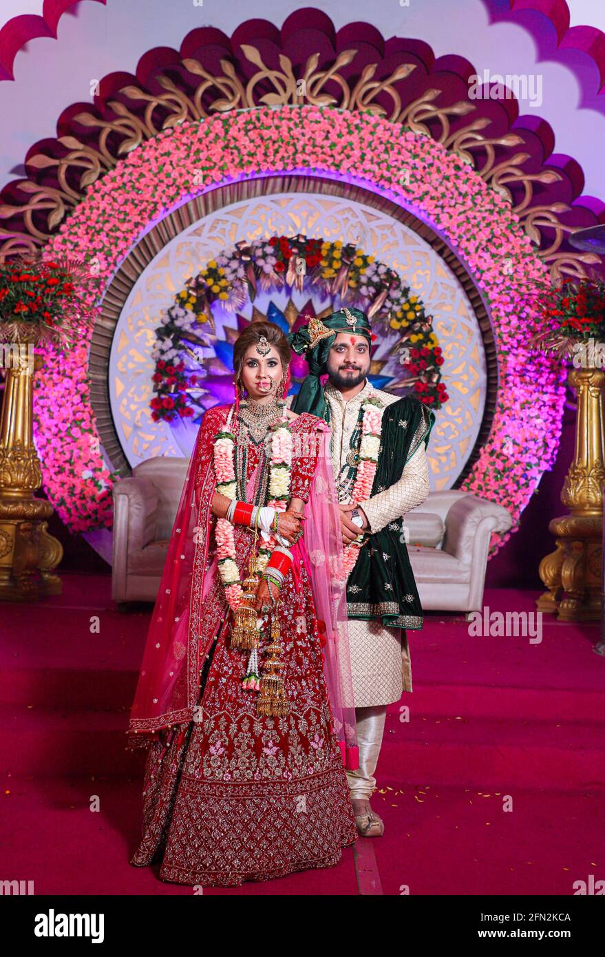 gorgeous stunning indian bride and groom wearing traditionally dress ...