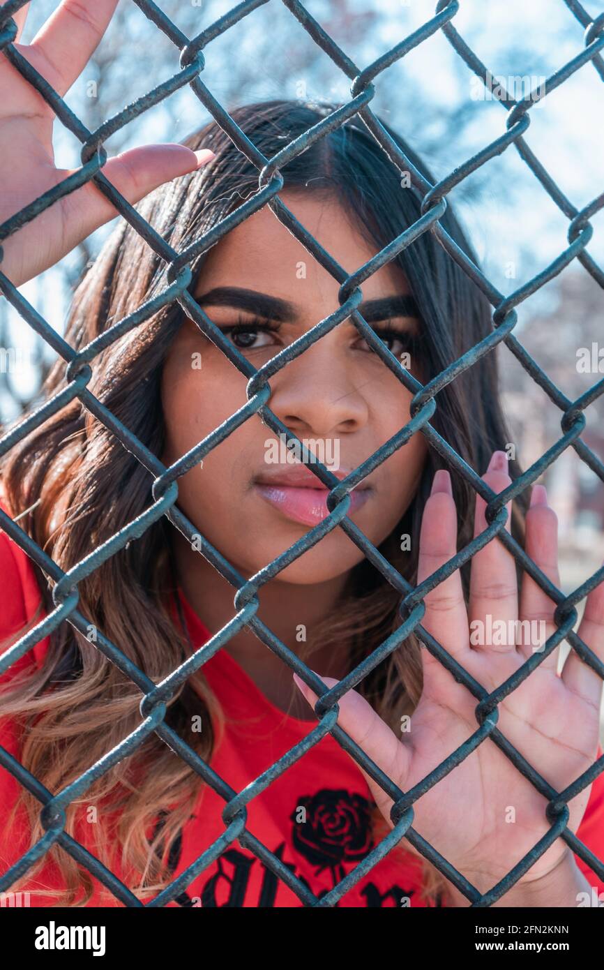 Young beautiful attractive woman in the cage Stock Photo - Alamy