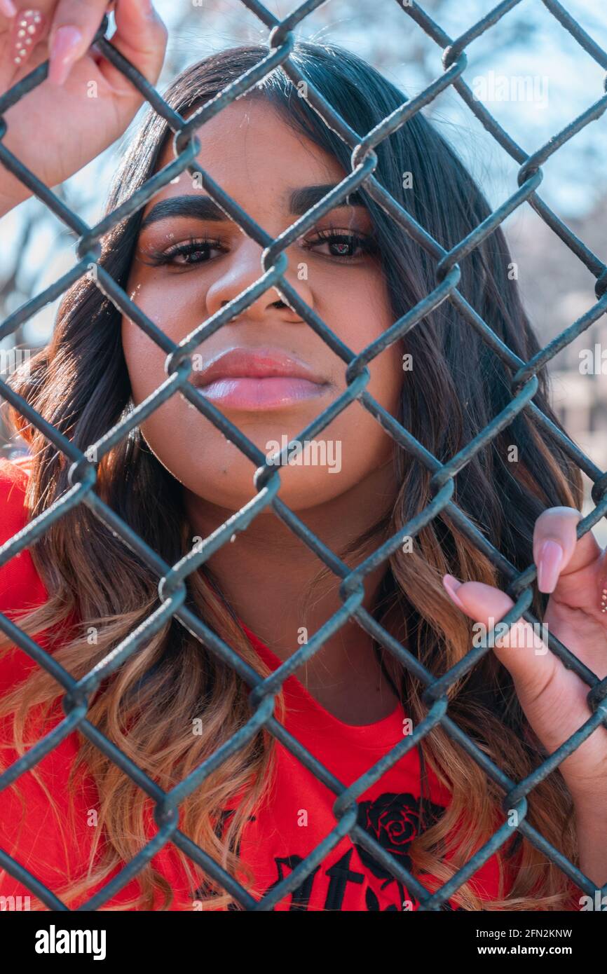portrait of a woman in a cage Stock Photo - Alamy