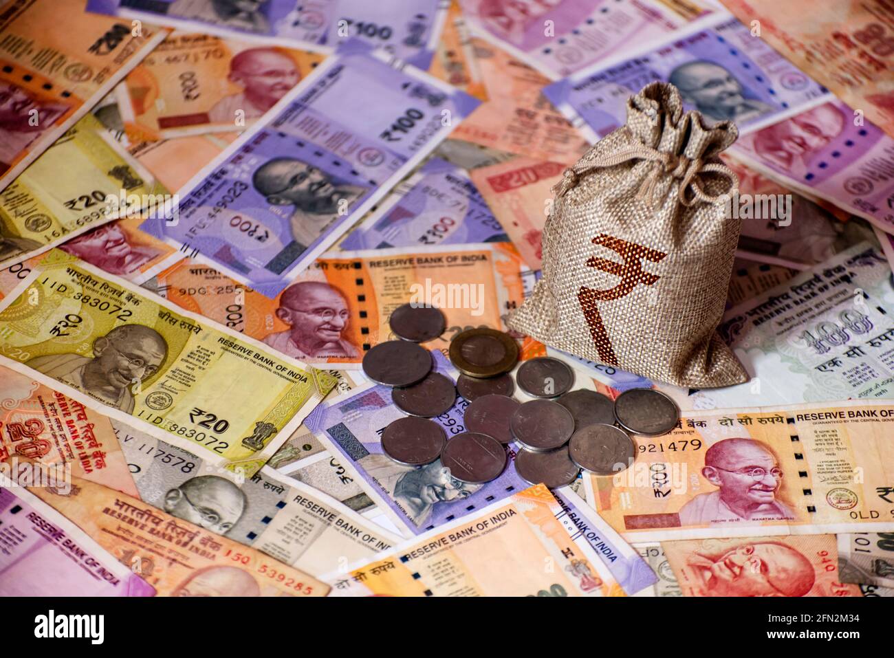 New Indian currency bank notes flat lay with coin and money bag. Top ...