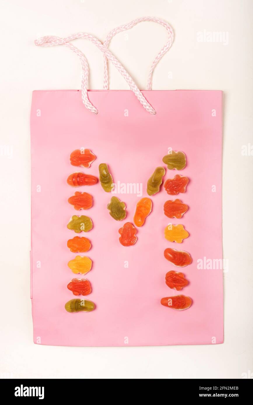 Colourful alphabet letters made from an arrangement of sweets (candies ...