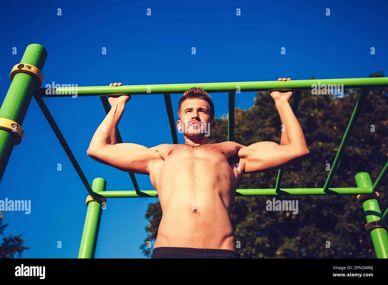Man doing pull ups exercises hi-res stock photography and images - Alamy