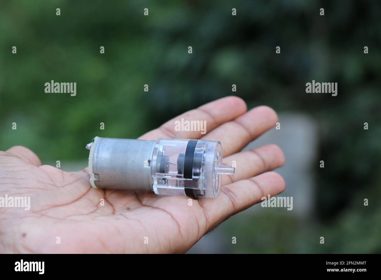 Mini air motor which pumps the air when its given power Stock Photo - Alamy