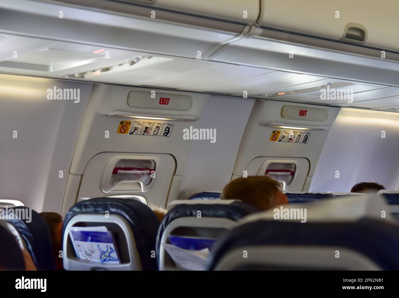 Emergency exit doors in the center of the aircraft Stock Photo - Alamy
