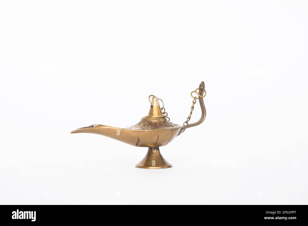 Vintage gold decorated magic lamp of Aladdin on white background Stock ...