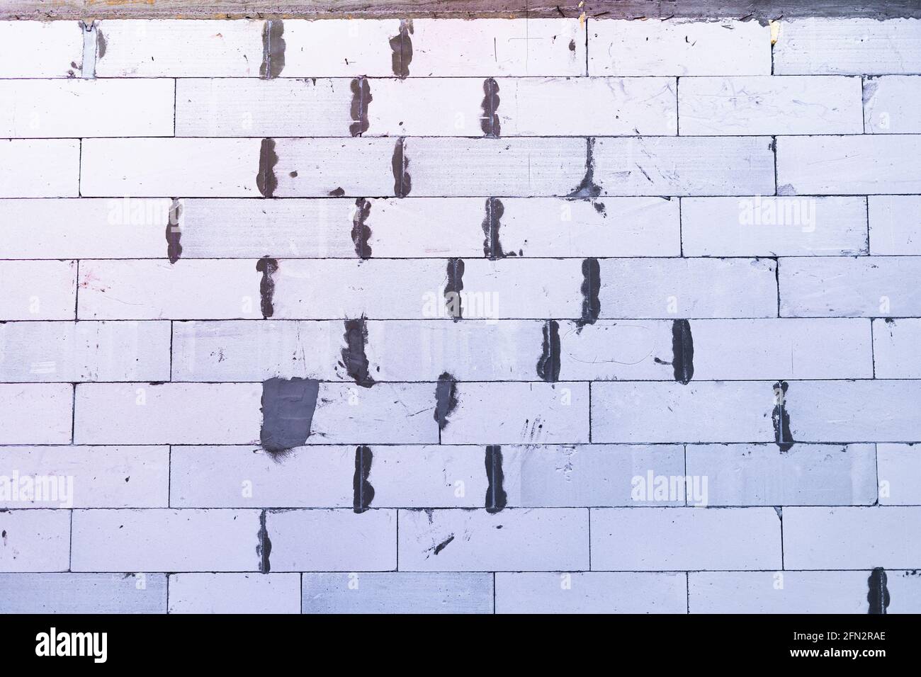 Background from a wall built from a white aerated block Stock Photo - Alamy