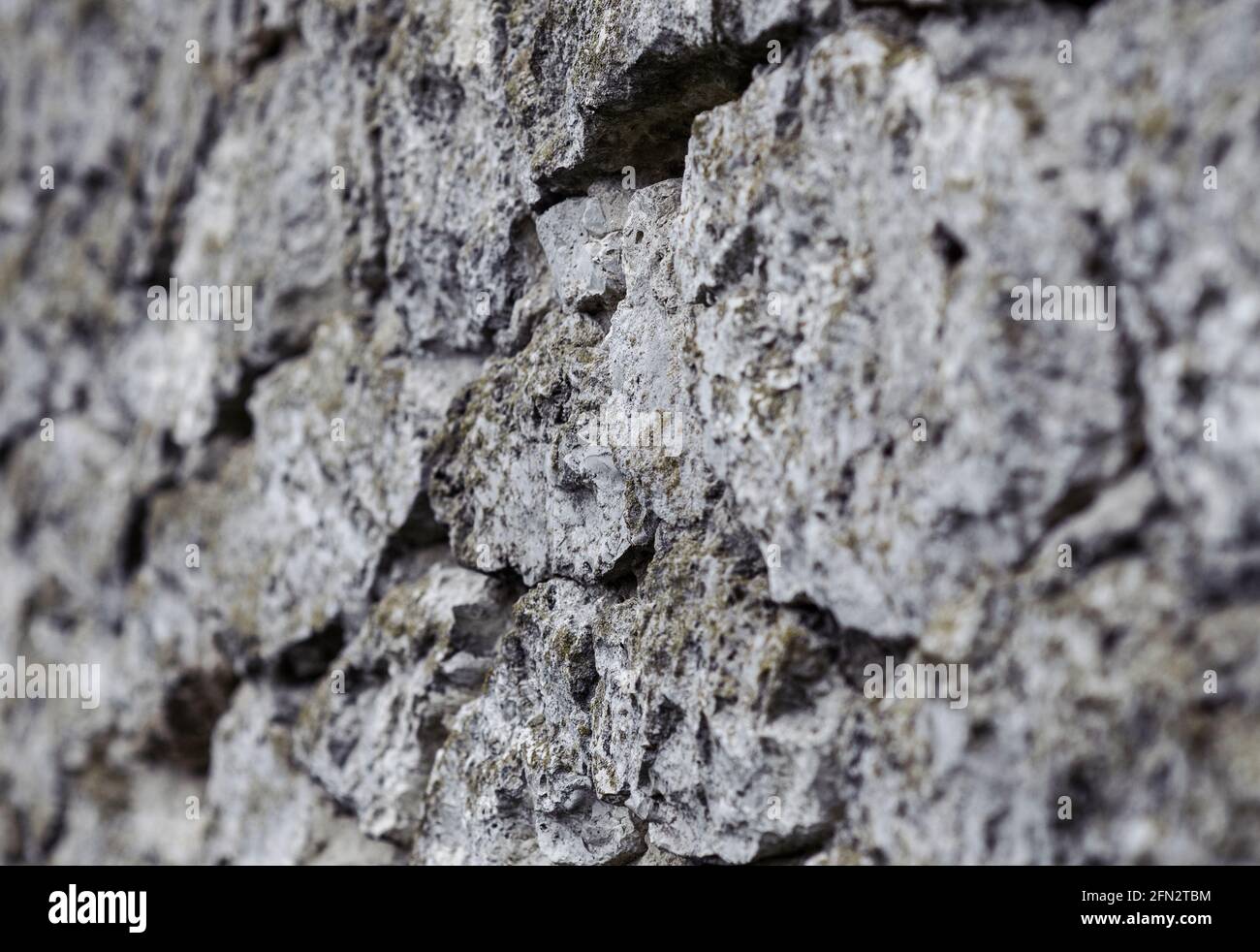 Stone wall made of natural untreated stone. Ancient castle wall Stock ...