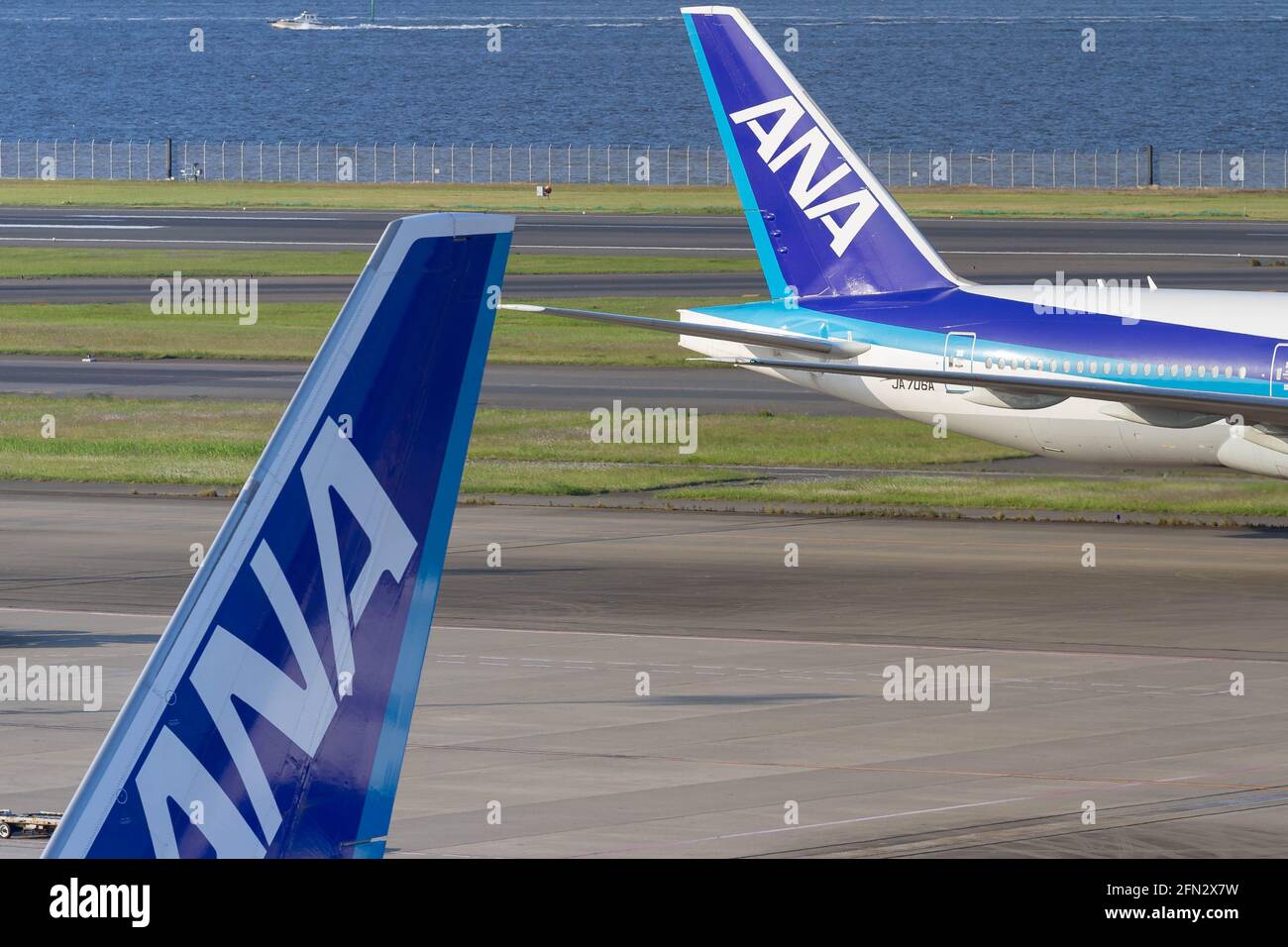 The tail planes of two All Nippon Airlines (ANA) Boeing 777 airliners ...