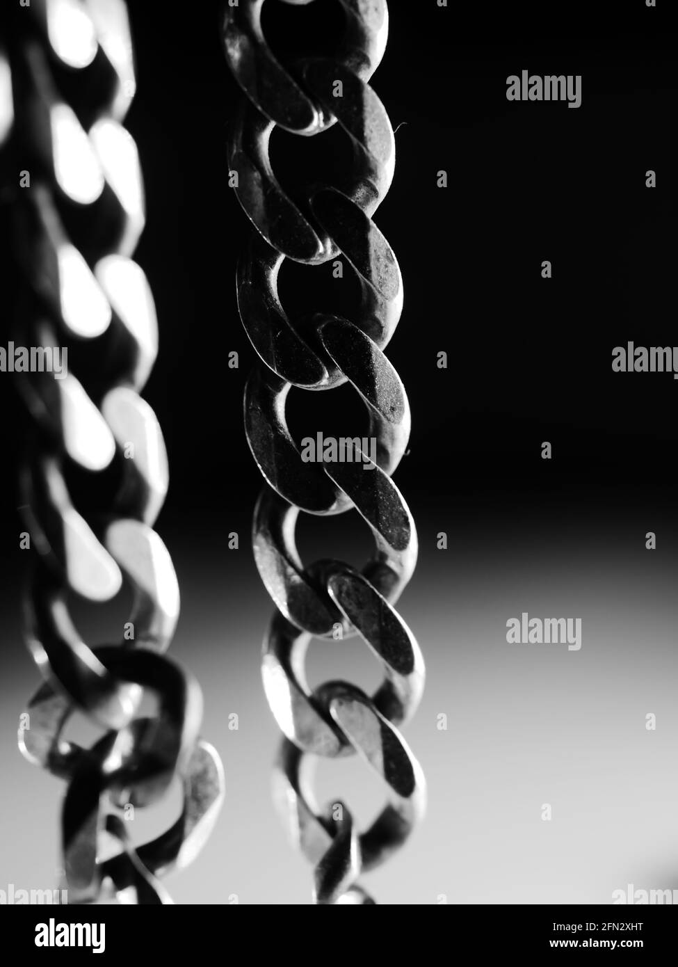 Vertical shot of a metal chain Stock Photo - Alamy