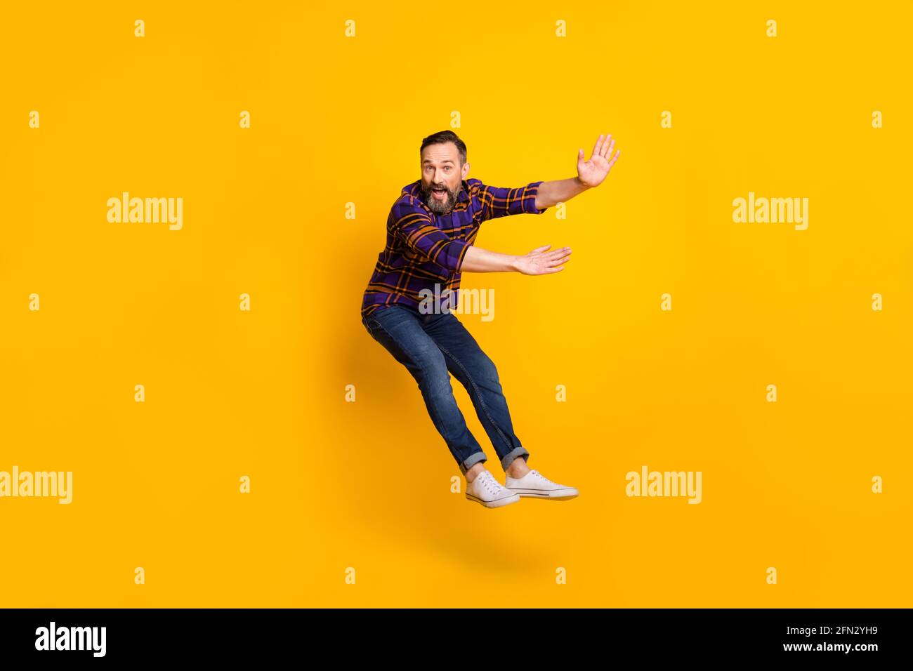Full length body size photo of man jumping flying back while windy ...