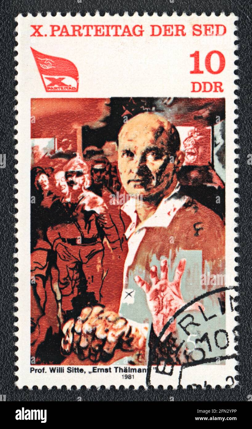 A postage stamp shows art portrait of Ernst Thalmann (1886-1944) by ...