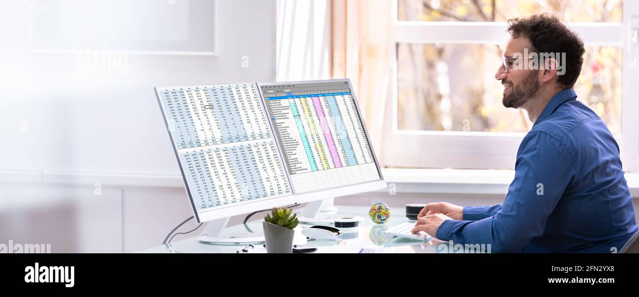 Analyst Employee Using Spreadsheet On Computer Screen Stock Photo - Alamy