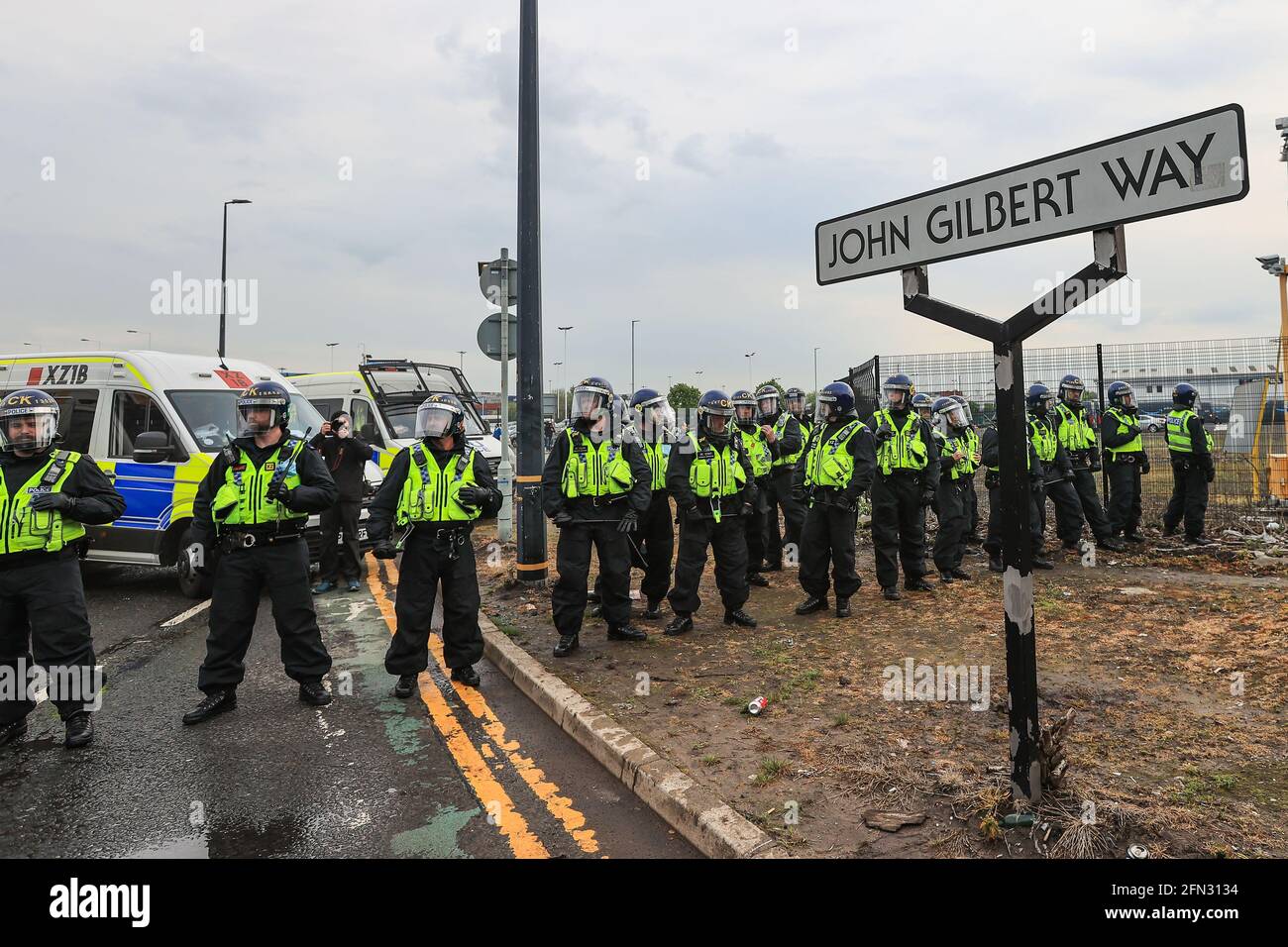 Police officers form a police cordon with riot gear on Stock Photo - Alamy