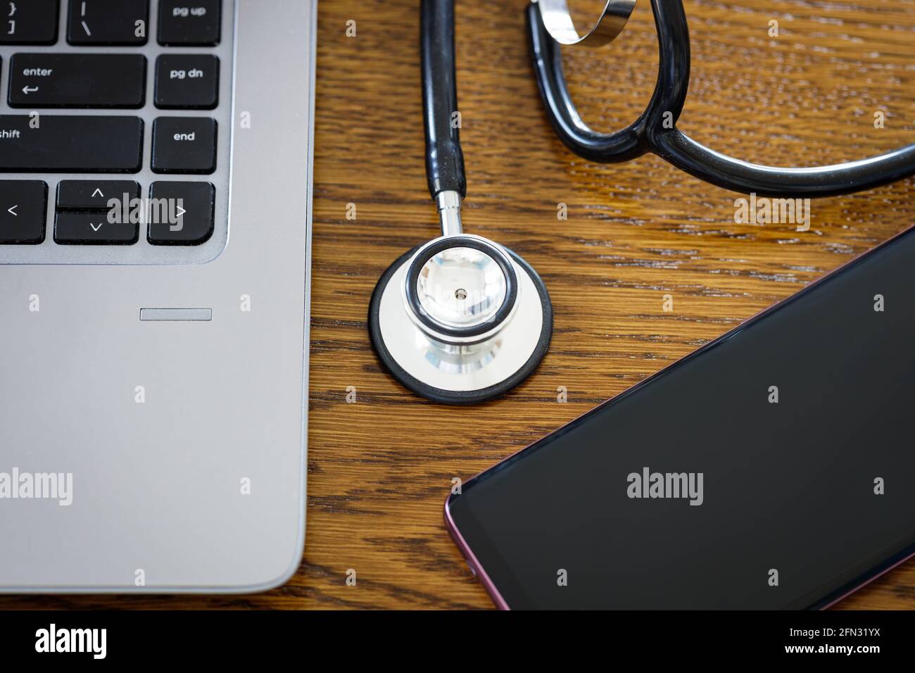 Telemedicine, remote advice and diagnose, laptop, mobile phone and ...