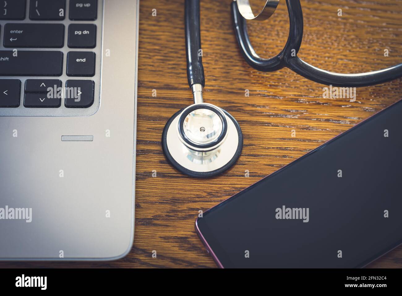 Telemedicine, remote advice and diagnose, laptop, mobile phone and ...