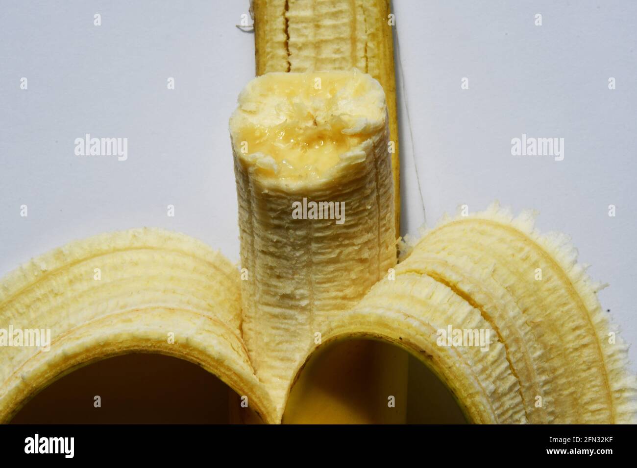 Half eaten Banana ,partially pealed, ripe yellow,healthy nutricious ...