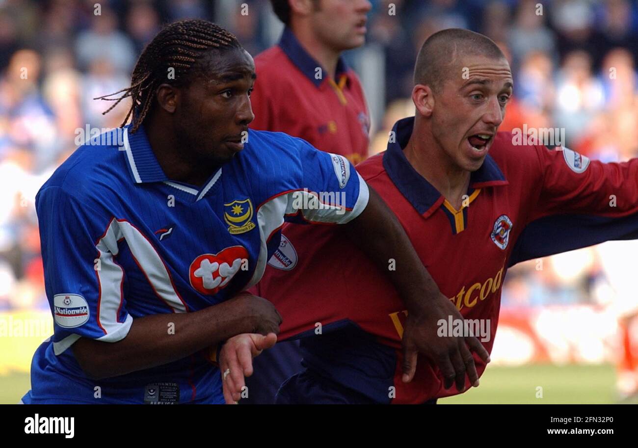 PORTSMOUTH V READING. GOALSCORER VINCENT PERICARD MUSCLES HIS WAY ROUND ...