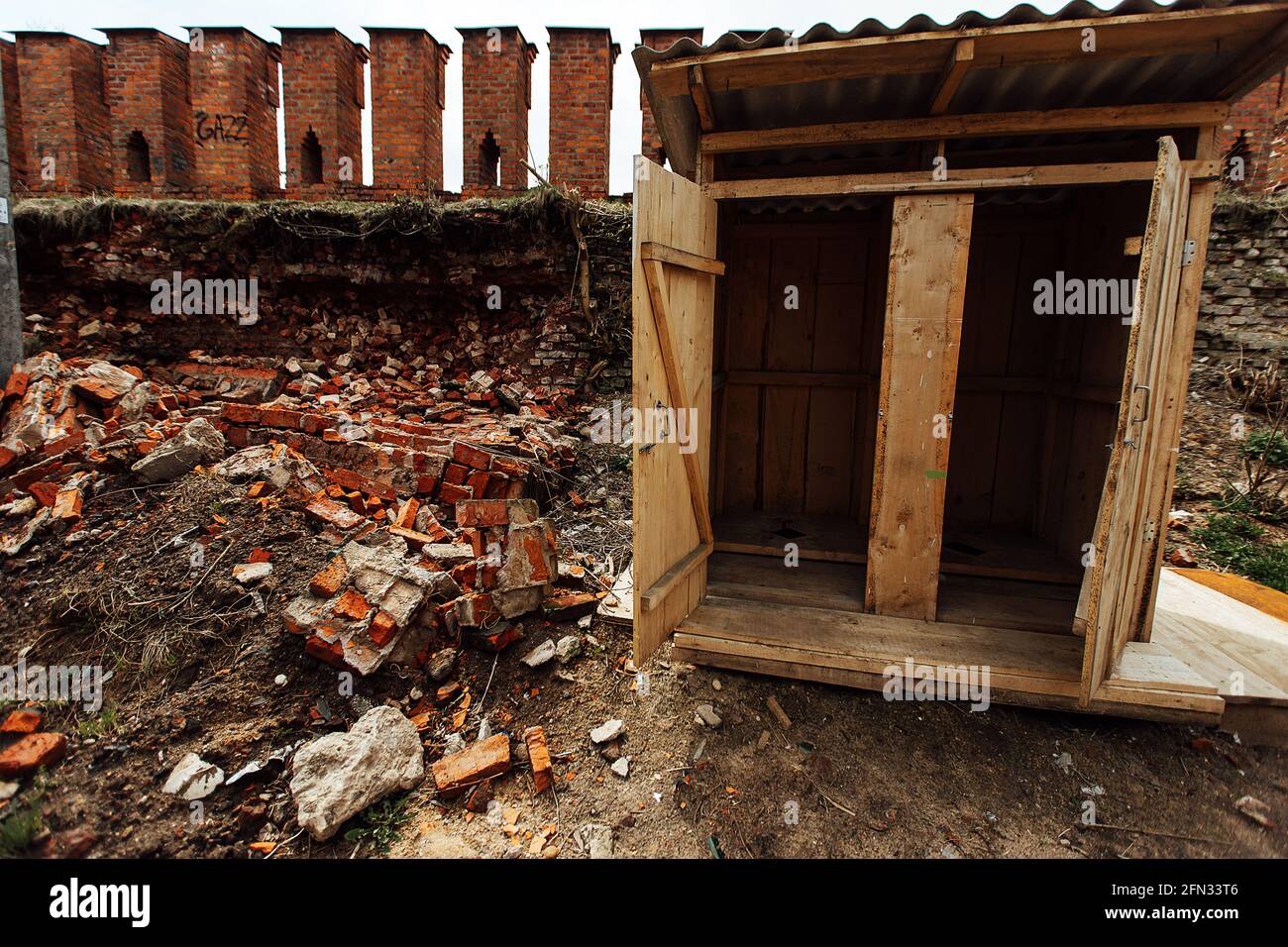 a brick wall destroyed by an explosion. the war destroys historical ...