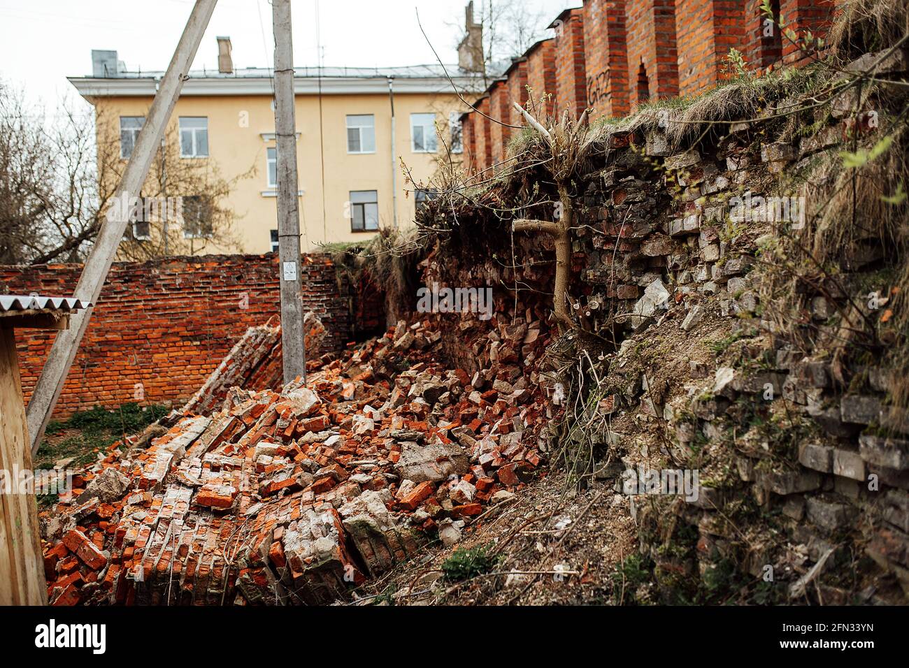 a brick wall destroyed by an explosion. the war destroys historical ...