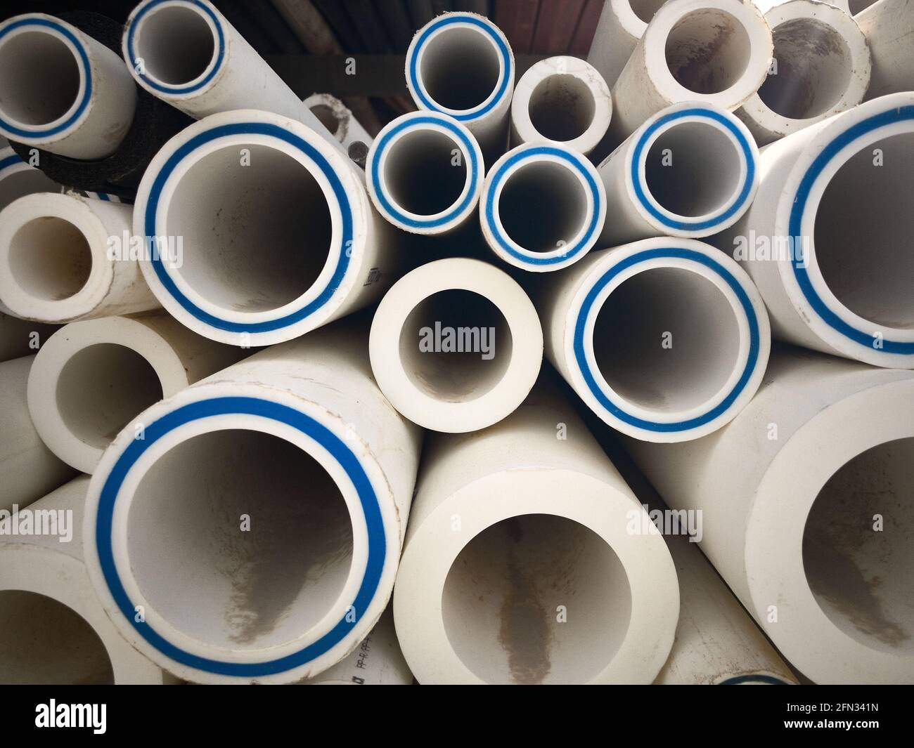 Stack of plastic LDPE water pipes Stock Photo - Alamy