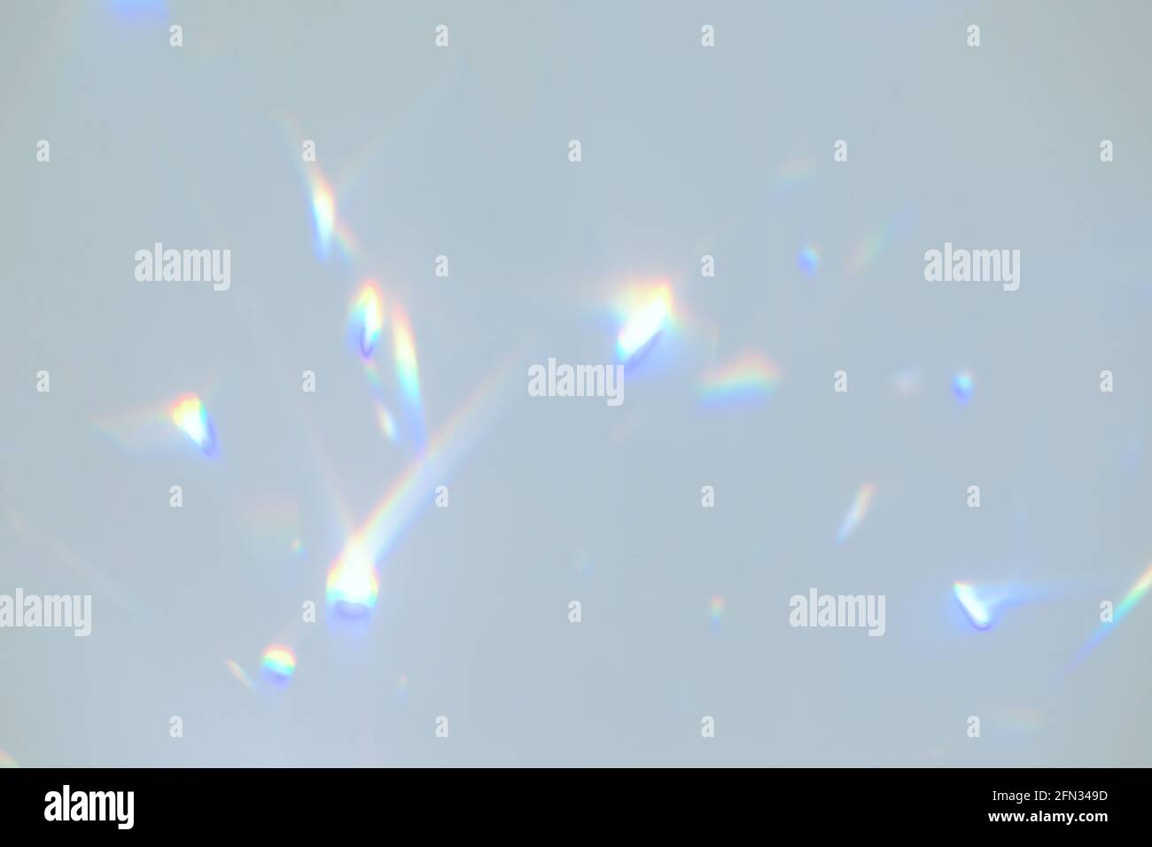 Blurred rainbow light refraction texture on white wall Stock Photo - Alamy