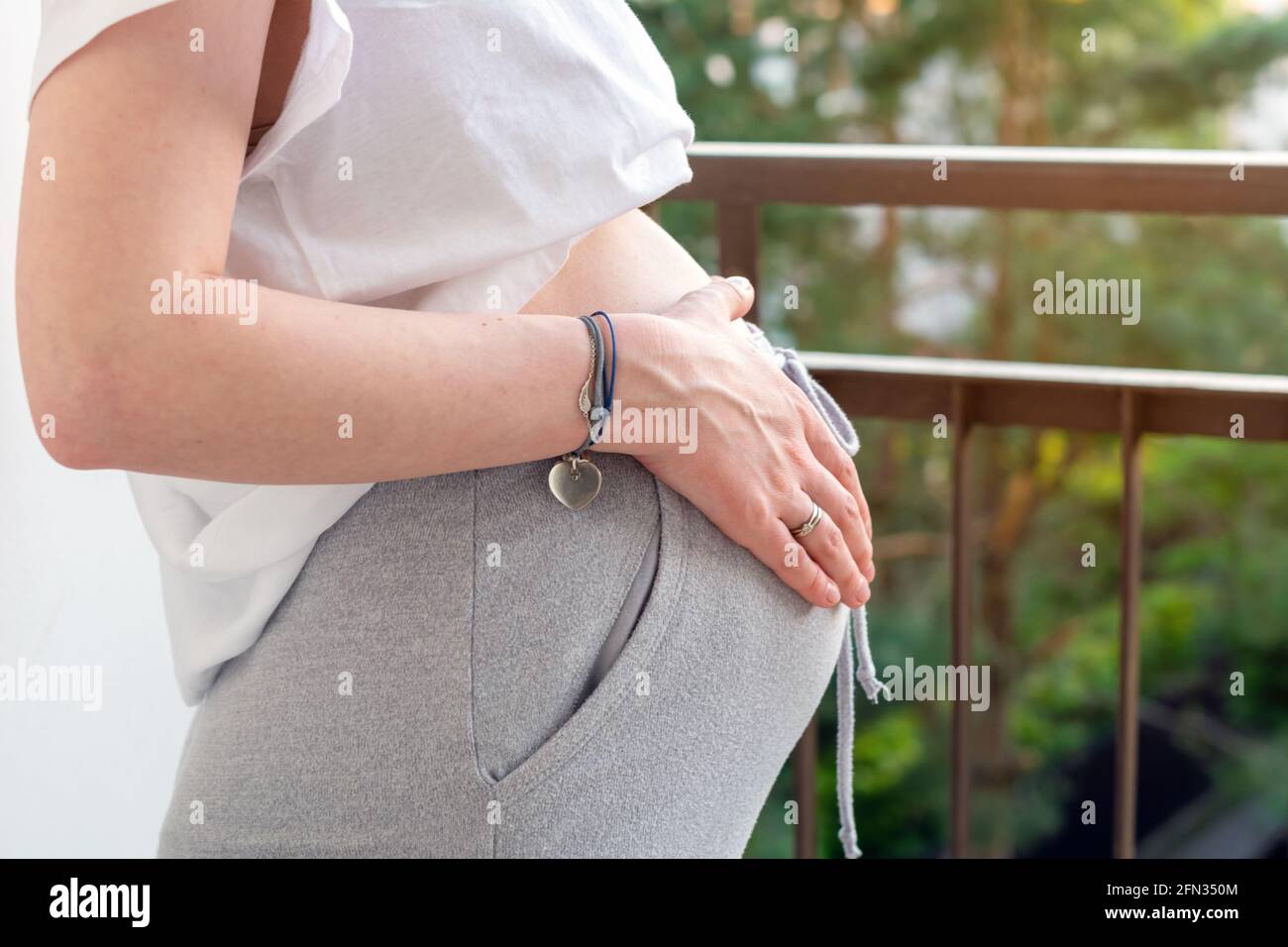 Hands on belly hi-res stock photography and images - Alamy