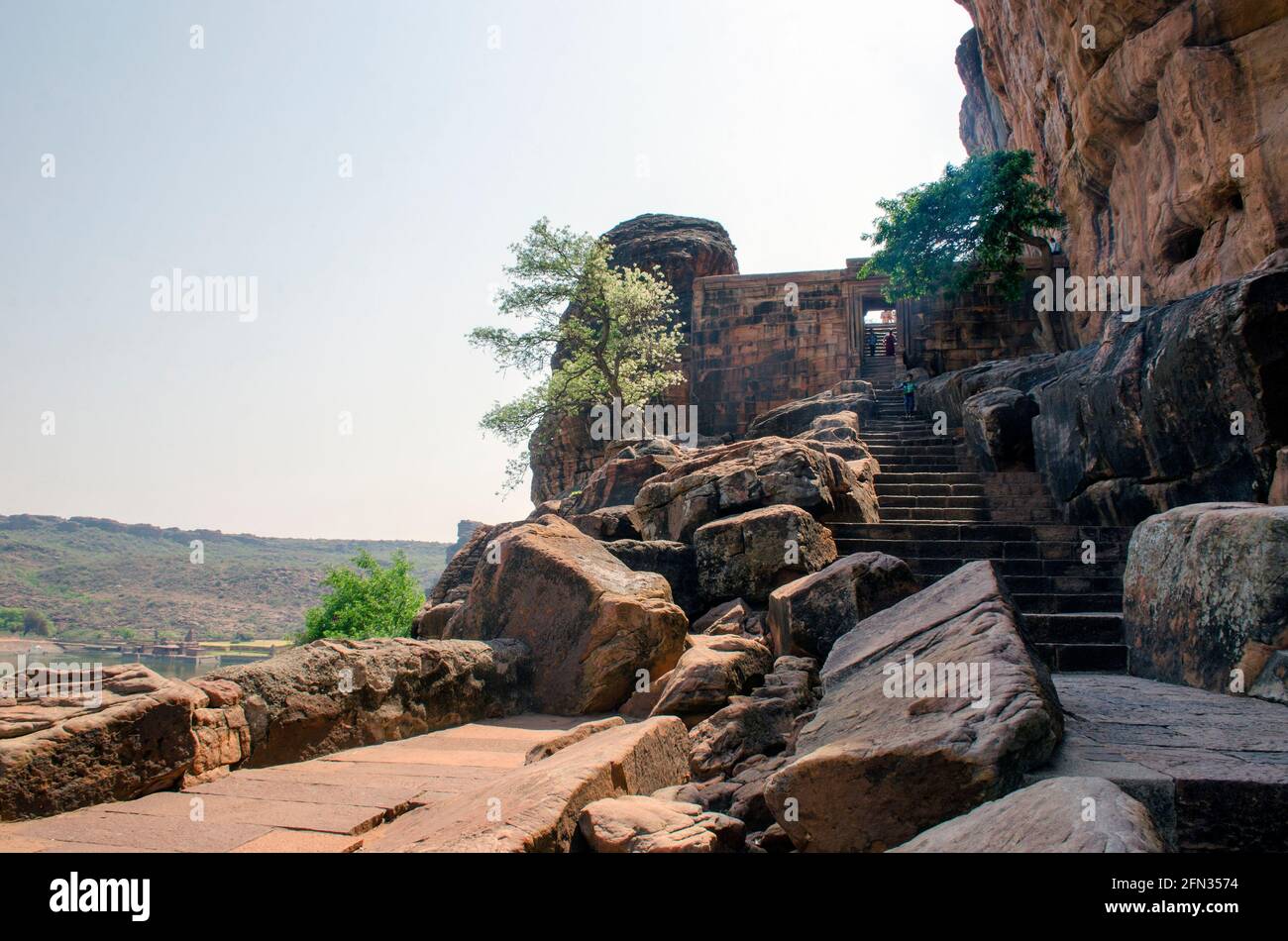 Pictures of the road and stairs leading to the Badami Cave Temple. A ...