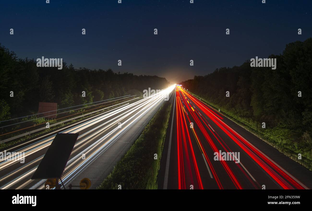 Long time exposure on a highway with red and white car light trails at ...