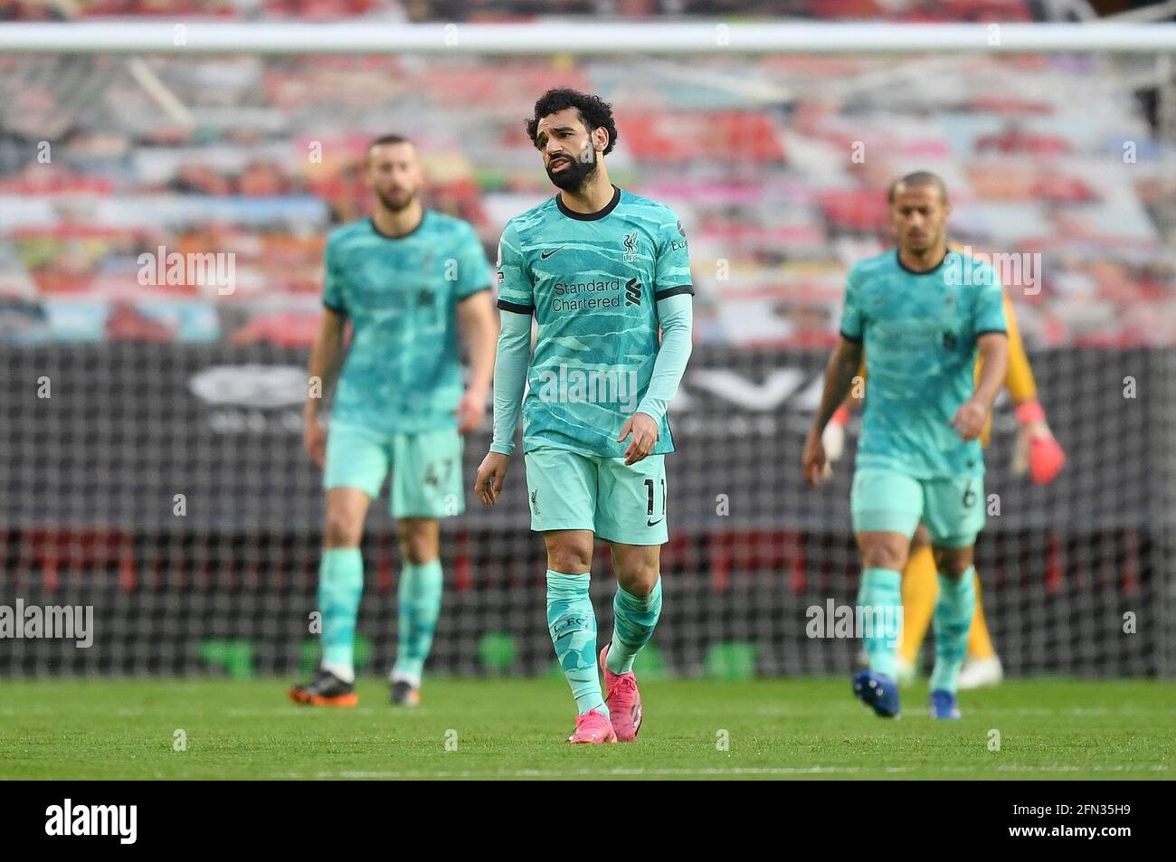 Liverpool's Mohamed Salah reacts after conceding the first goal during ...