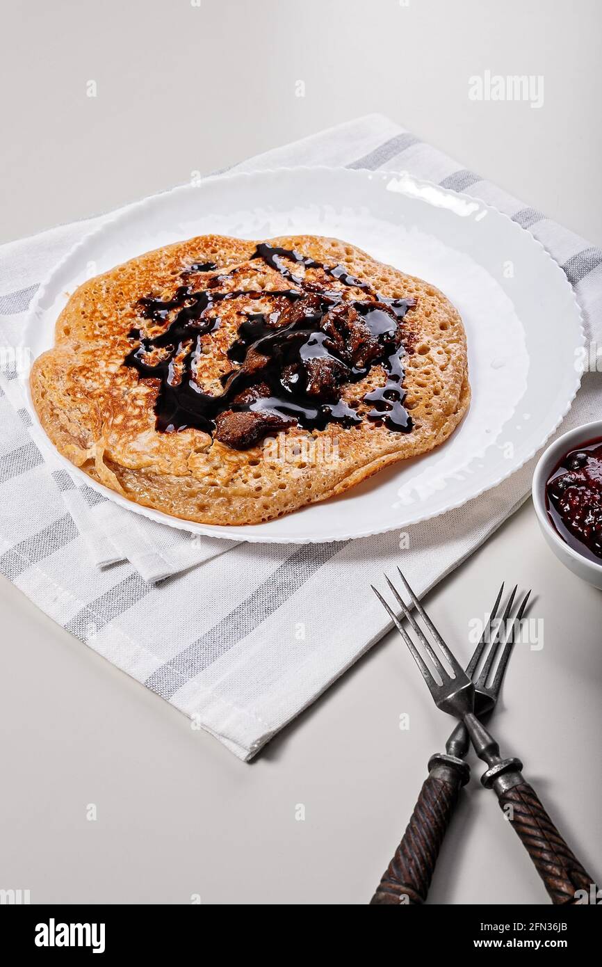 Close-up homemade appetizing hot pancake with chocolate sauce ...